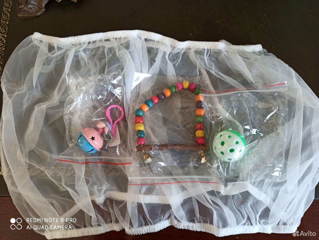 Игрушки, качелька и сетка для попугая